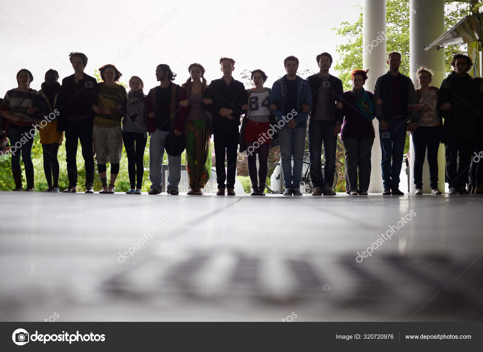 Silhouettes People Standing Line Stock Photo by ©ImageSource 320720976