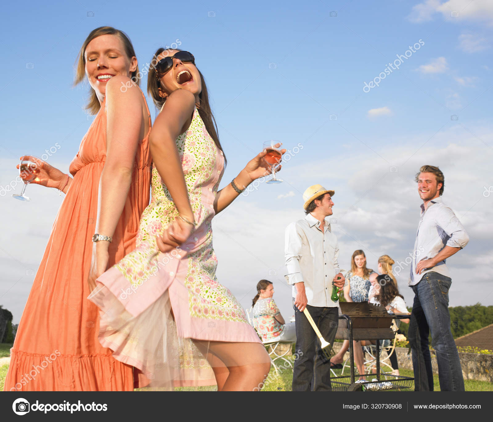 Young Women Dancing Barbecue Stock Photo by ©ImageSource 320730908