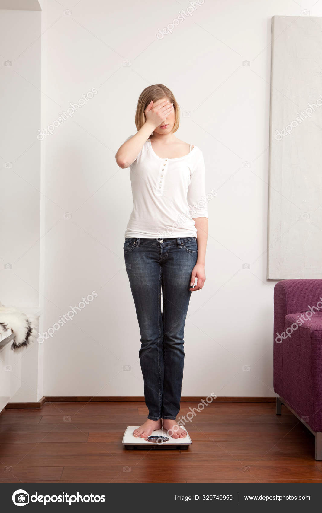 Woman Standing Scale Stock Photo by ©ImageSource 320740950