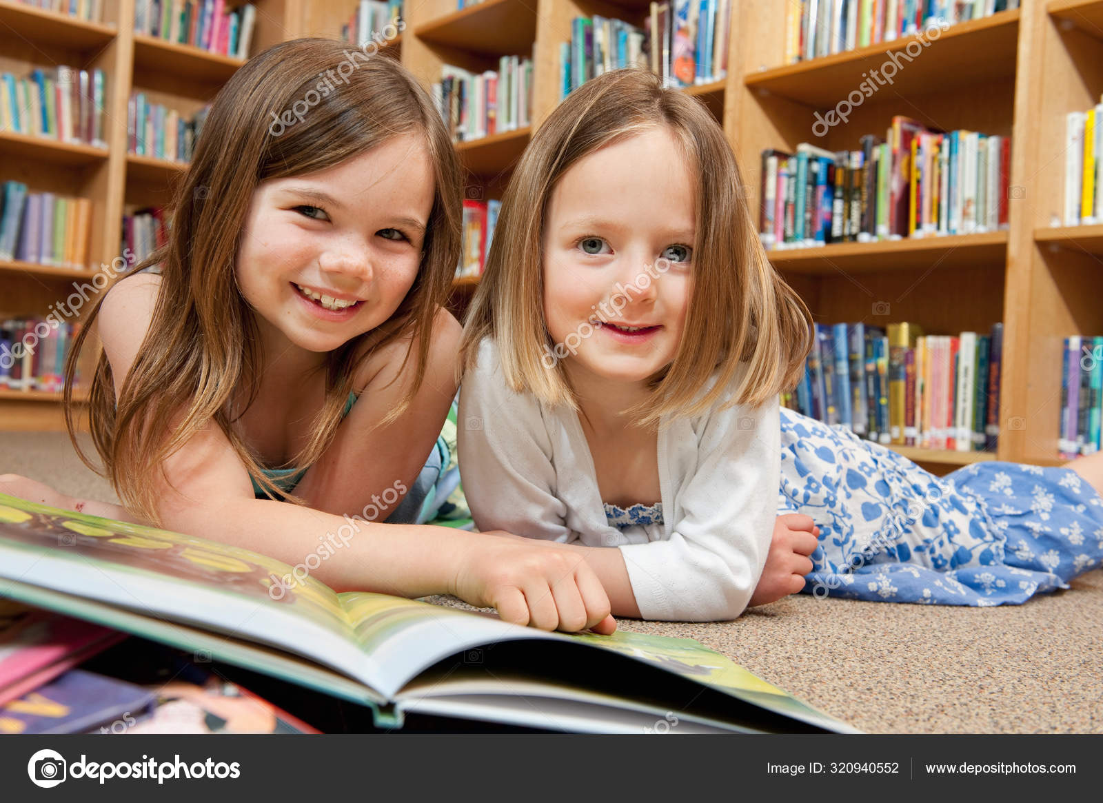 Little Girl Reading Book Home Stock Photo by ©ImageSource 320940552