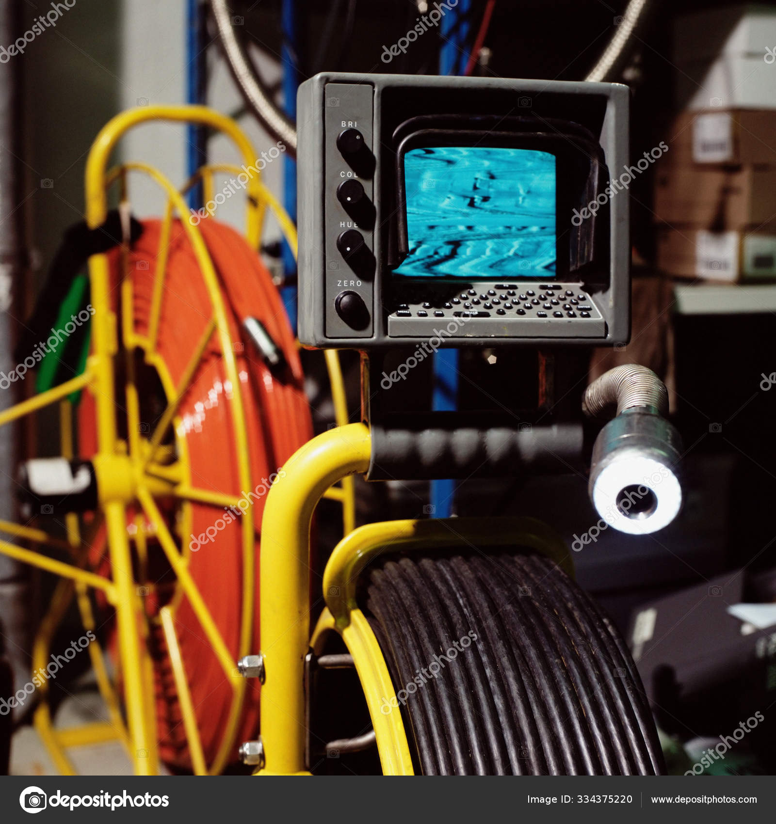 Coiled pipe and monitor — Stock Photo © ImageSource #334375220