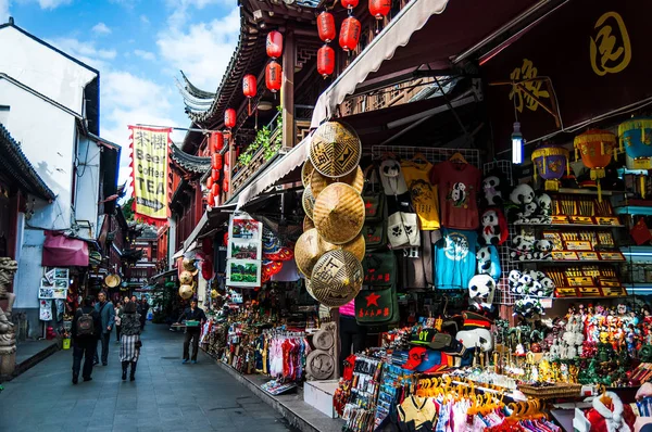 Chinese souvenirs. Various asian figures in the gift shop in Shanghai ...