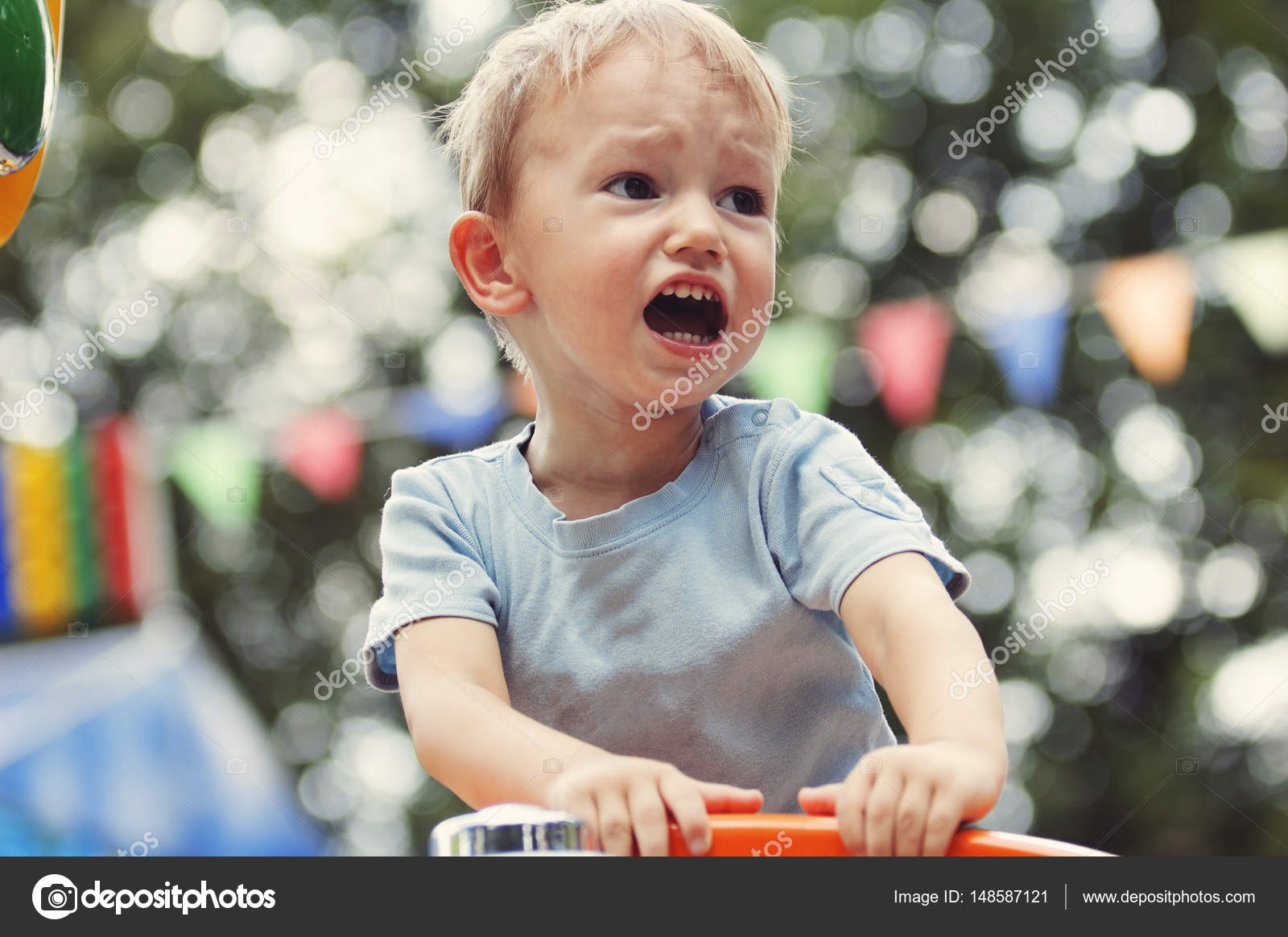 Cute little boy crying at a party Stock Photo by ©nozyer 148587121