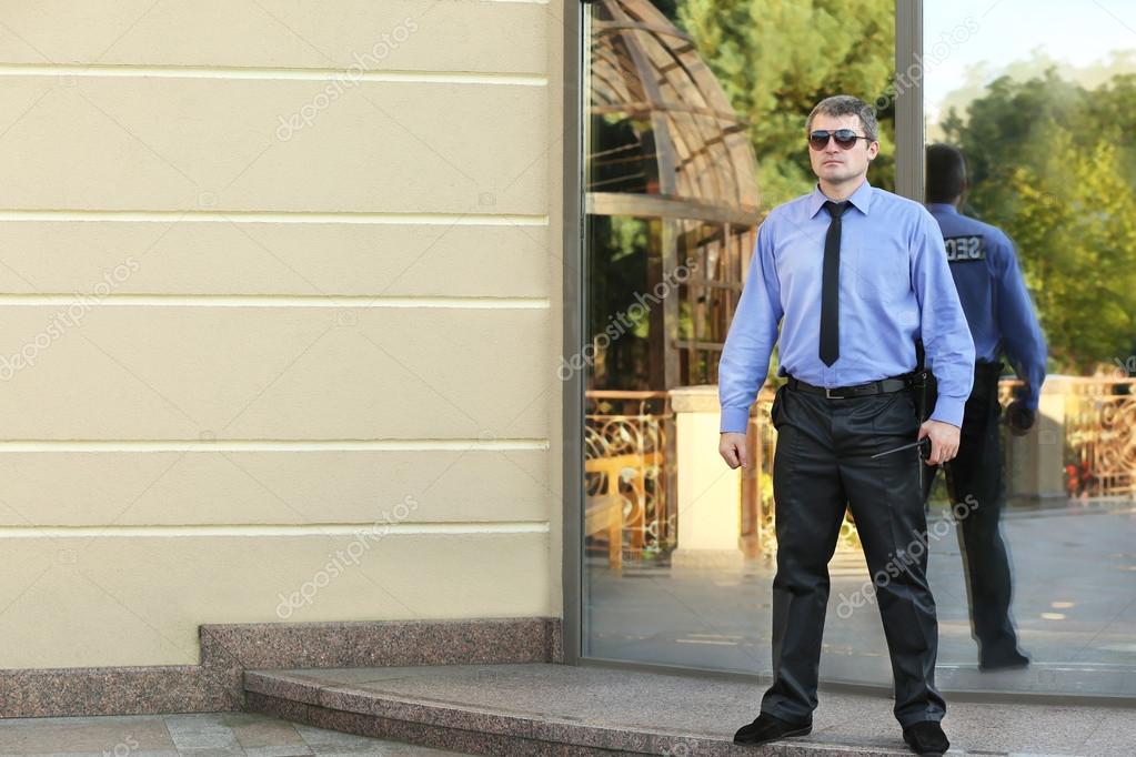 Male security guard Stock Photo by ©belchonock 126335740