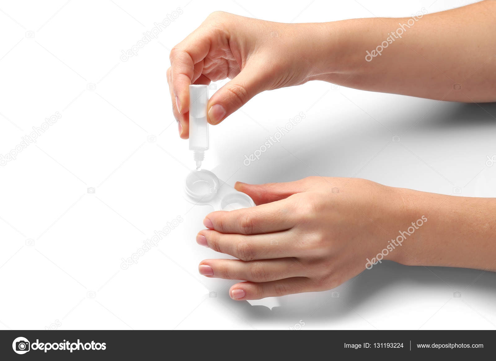 Hands adding solution to lens container Stock Photo by ©belchonock ...
