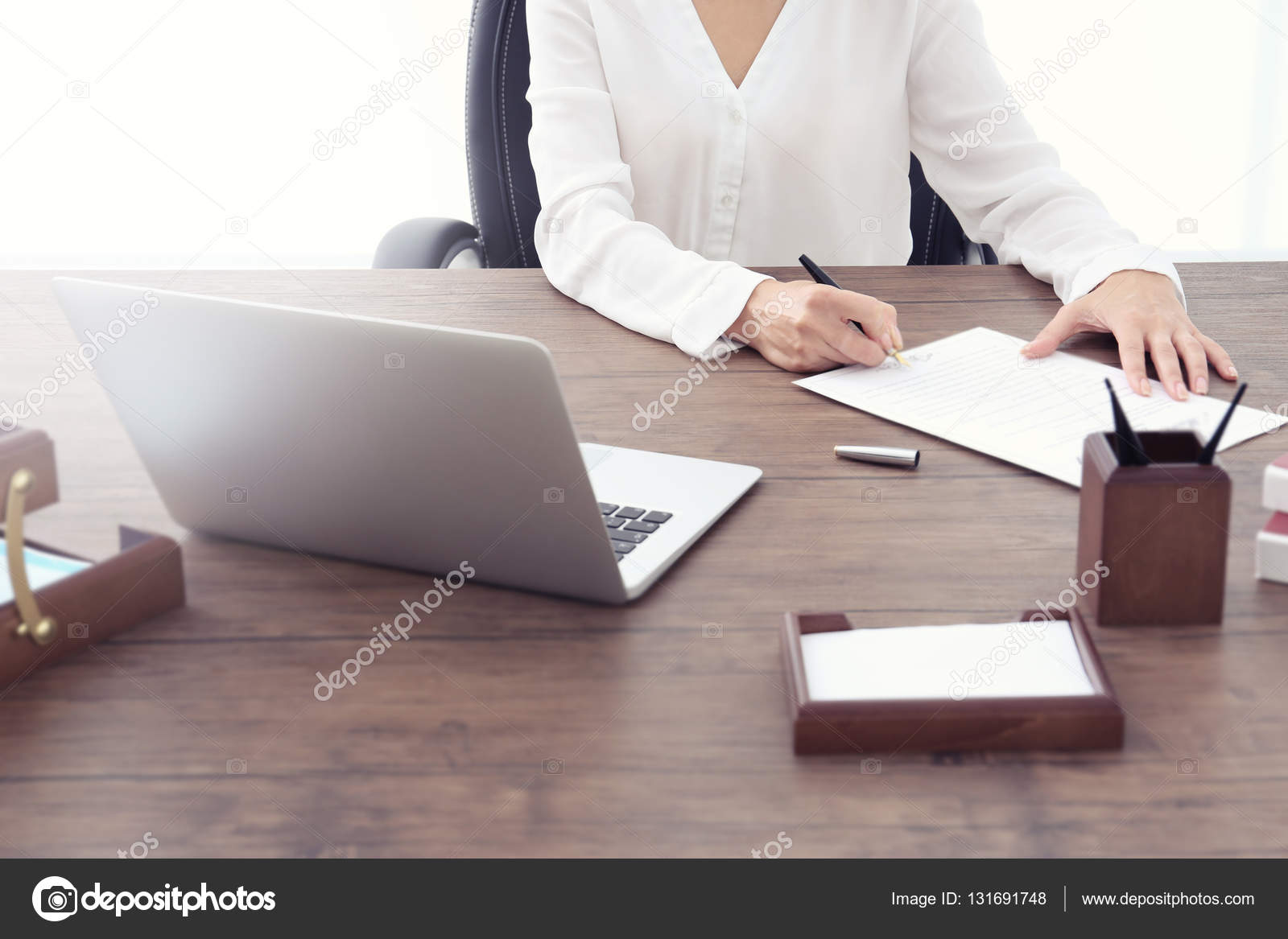 Female lawyer signing documents in office — Stock Photo © belchonock ...