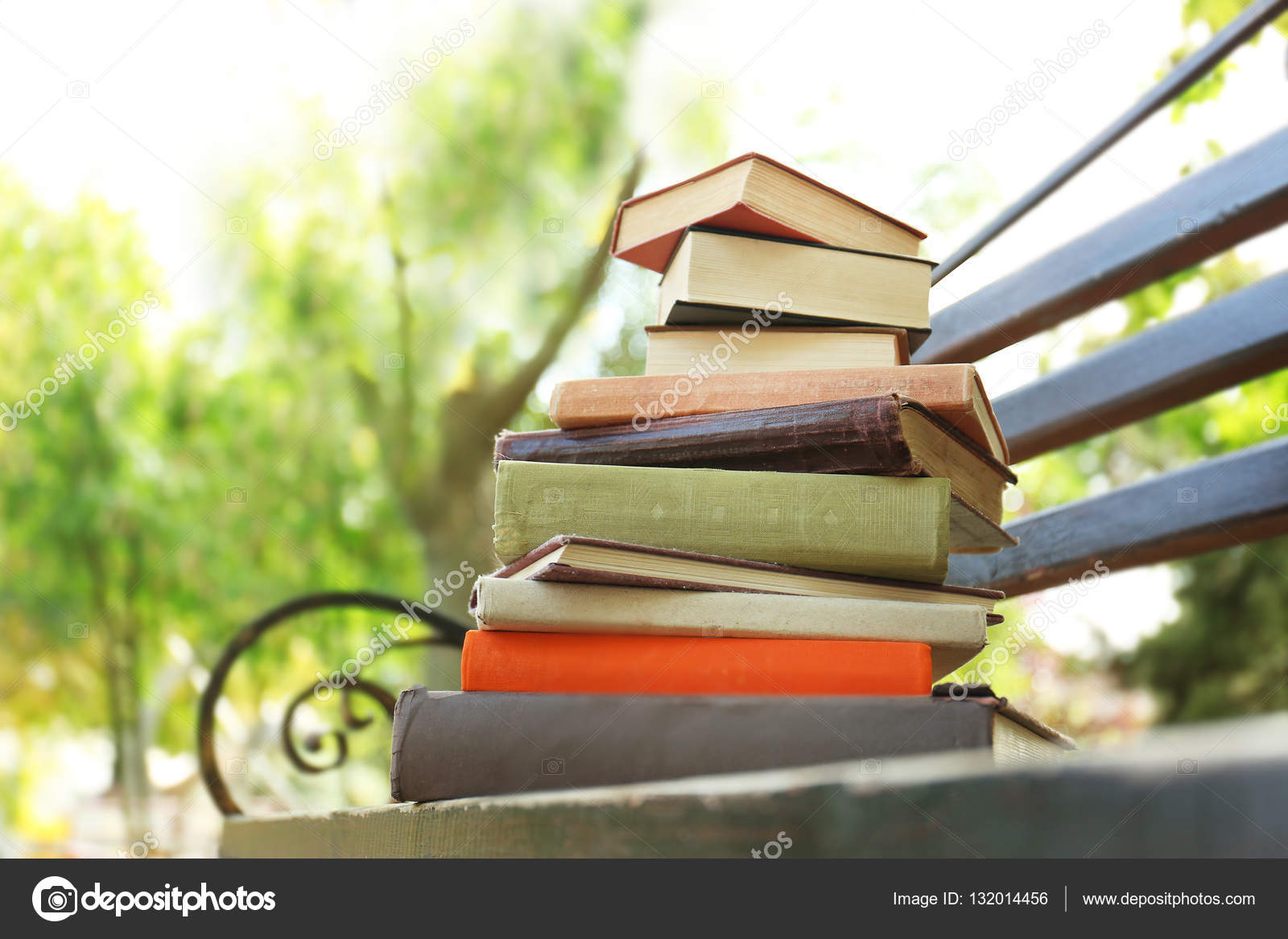 Pile of books on bench Stock Photo by ©belchonock 132014456