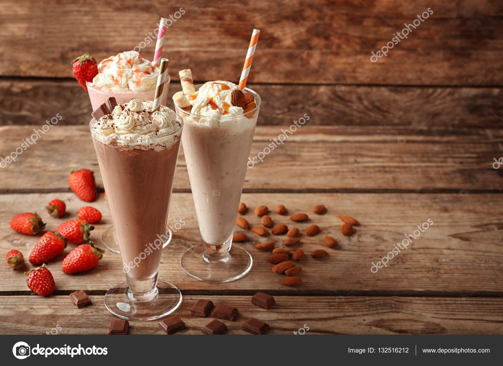 Delicious milkshakes in glasses Stock Photo by ©belchonock 132516212