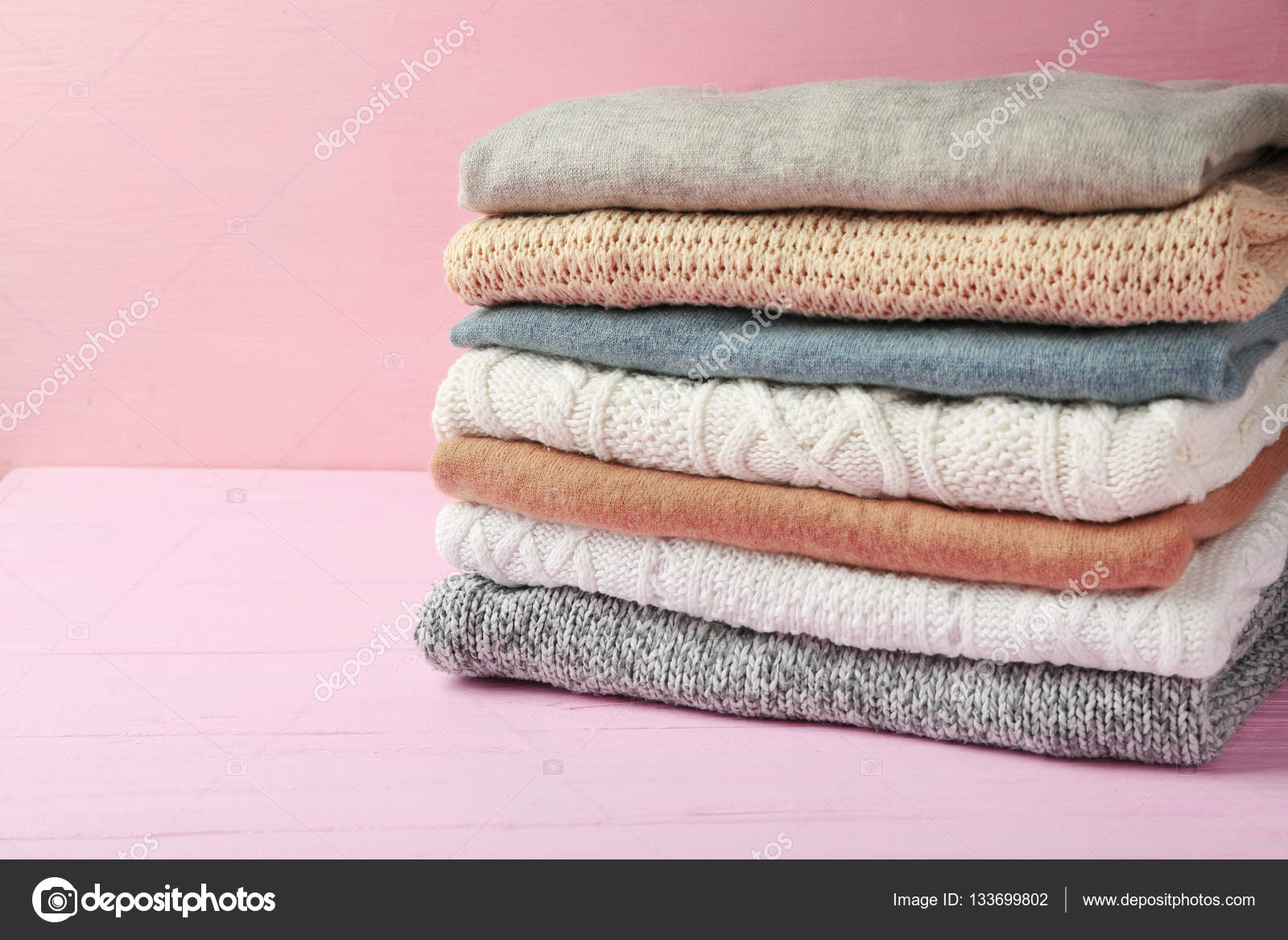 Stack of folded clothes Stock Photo by ©belchonock 133699802