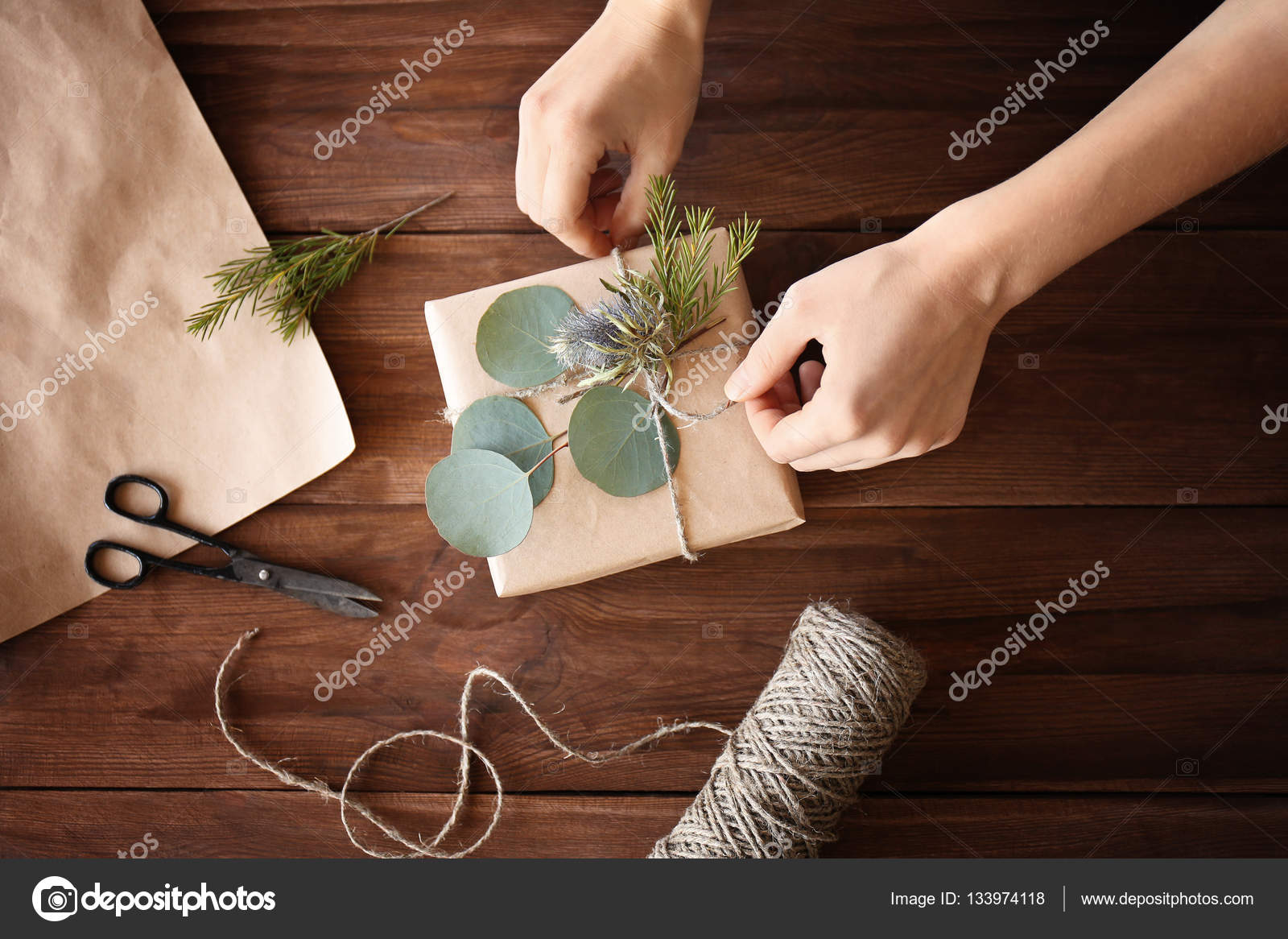 Female hands making gift box Stock Photo by ©belchonock 133974118