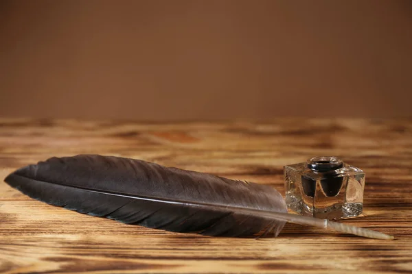 Feather pen and inkwell — Stock Photo © belchonock #133794068