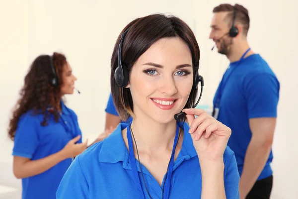 Young beautiful technical support dispatcher working in office, closeup ...