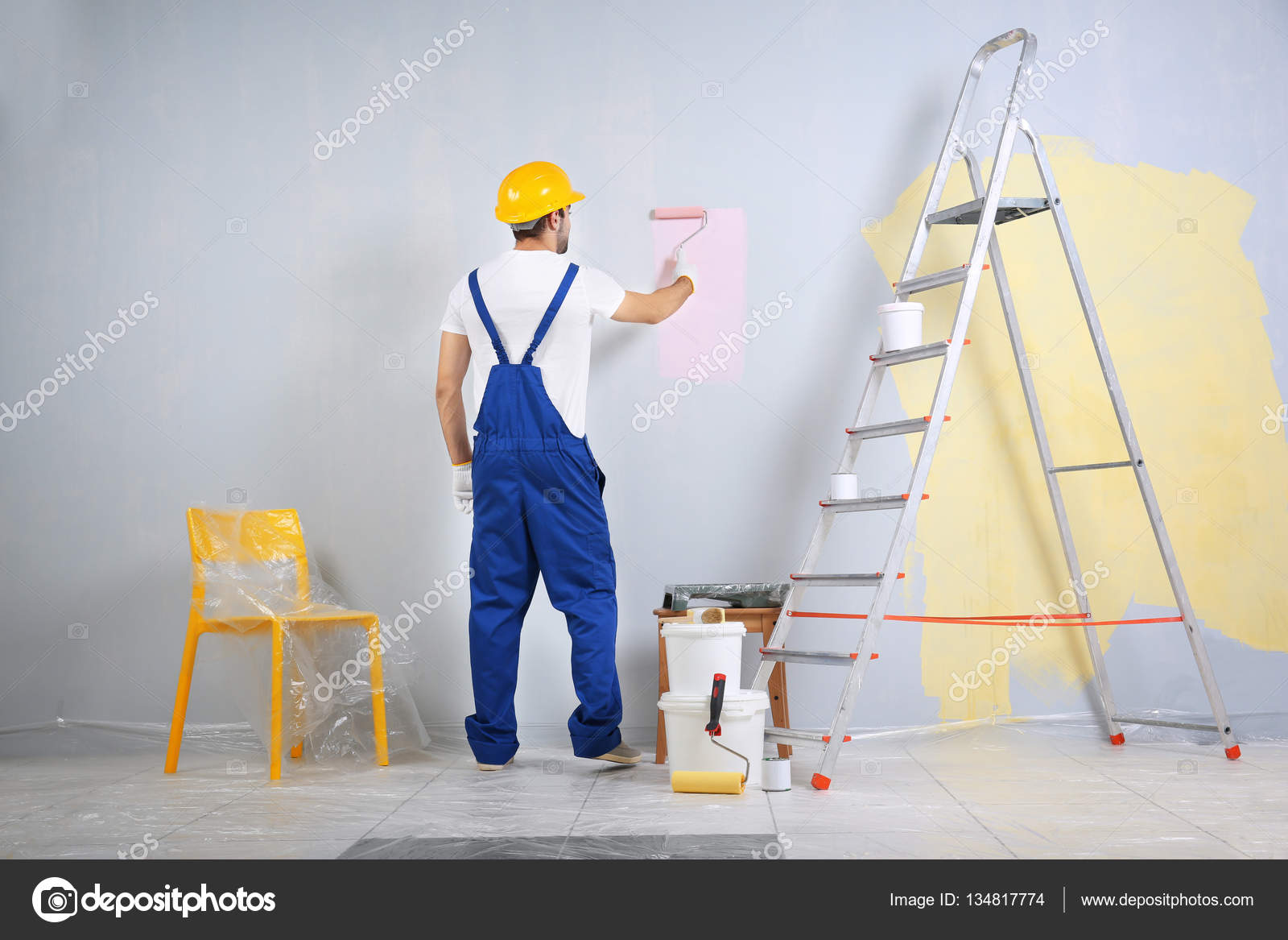 Worker painting wall — Stock Photo © belchonock #134817774