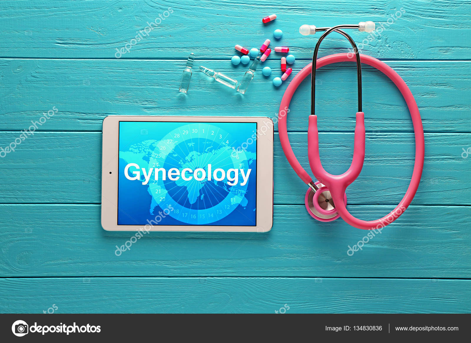 Gynecology concept with tablet Stock Photo by ©belchonock 134830836