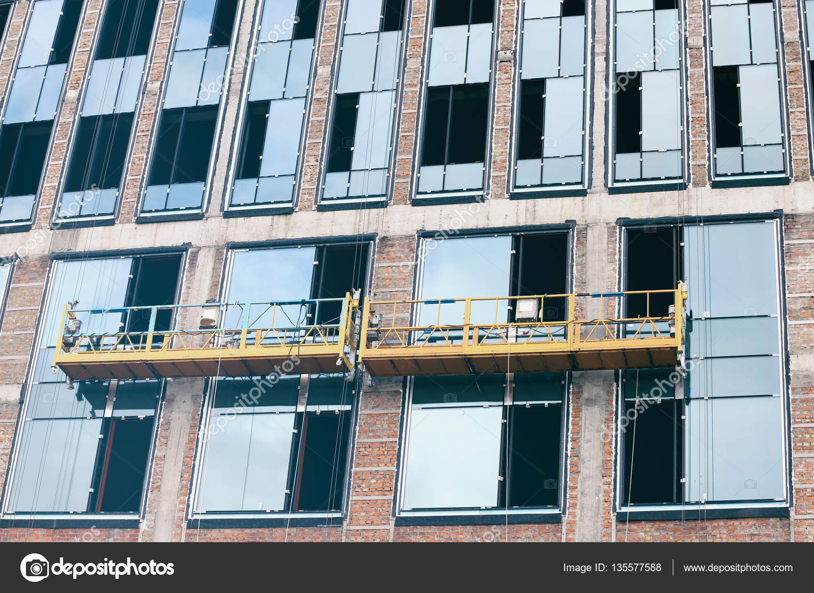 Building with installed windows Stock Photo by ©belchonock 135577588