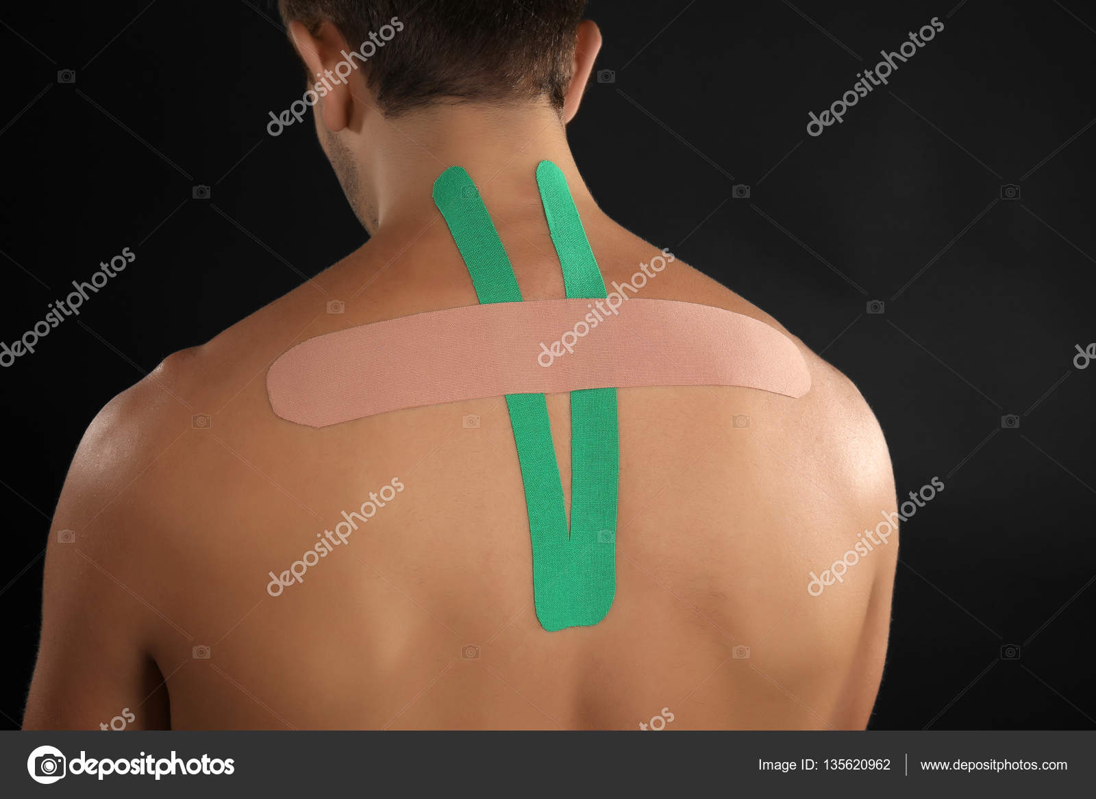 Back with applied physio tape Stock Photo by ©belchonock 135620962