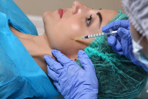 Procedure of facial injection Stock Photo by ©belchonock 136299736