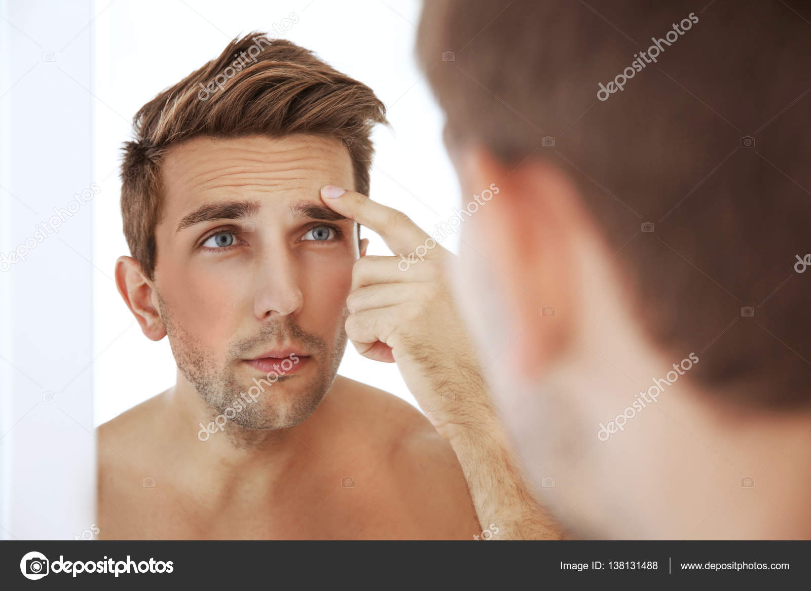 Man standing in front of mirror — Stock Photo © belchonock #138131488