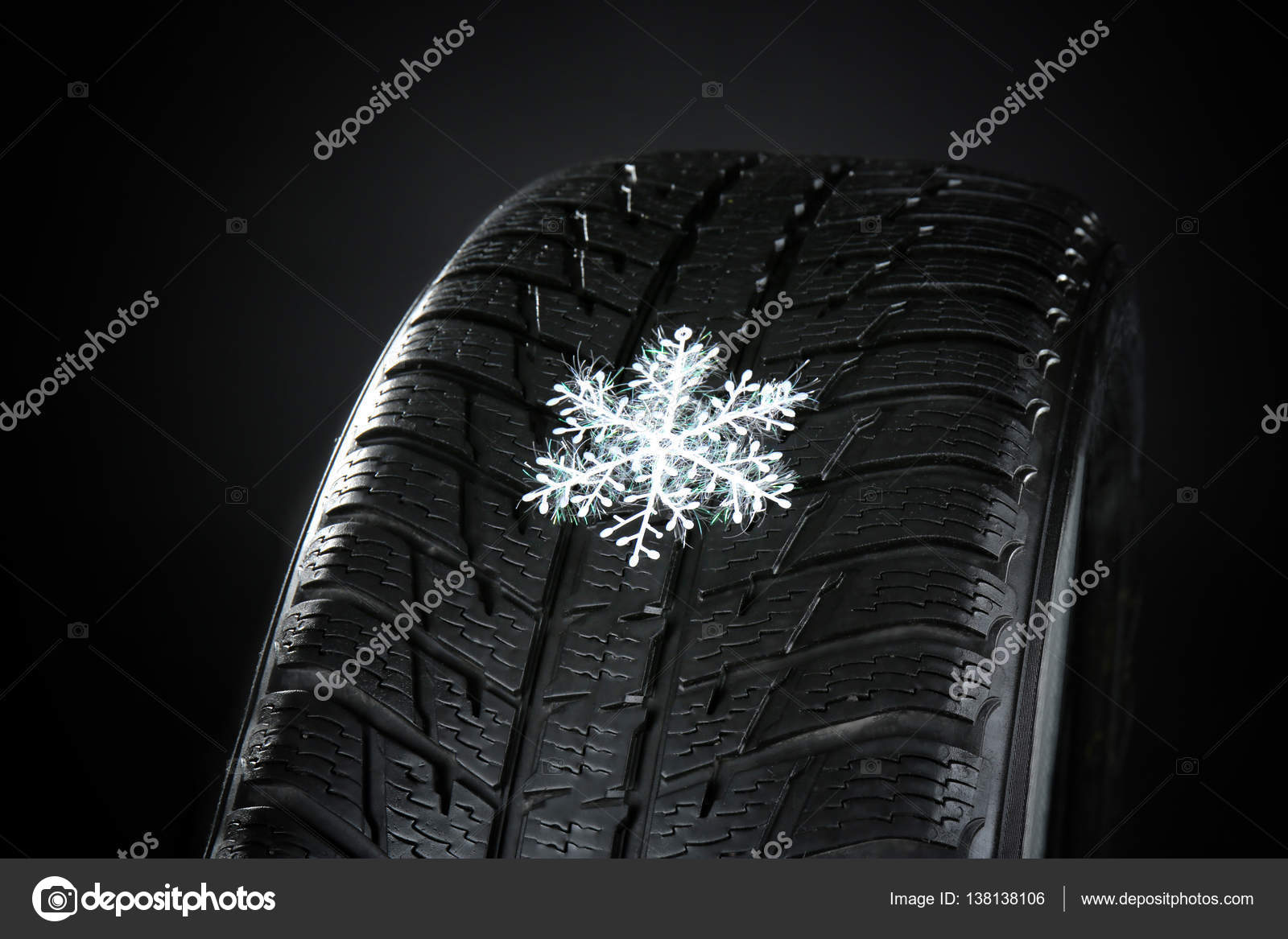 Rubber winter tire with snowflake — Stock Photo © belchonock #138138106