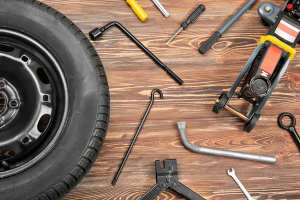 Car wheel with tools ⬇ Stock Photo, Image by © belchonock #141182928
