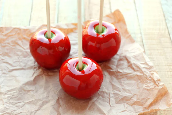 Candy apples on crumpled paper - Stock Image - Everypixel