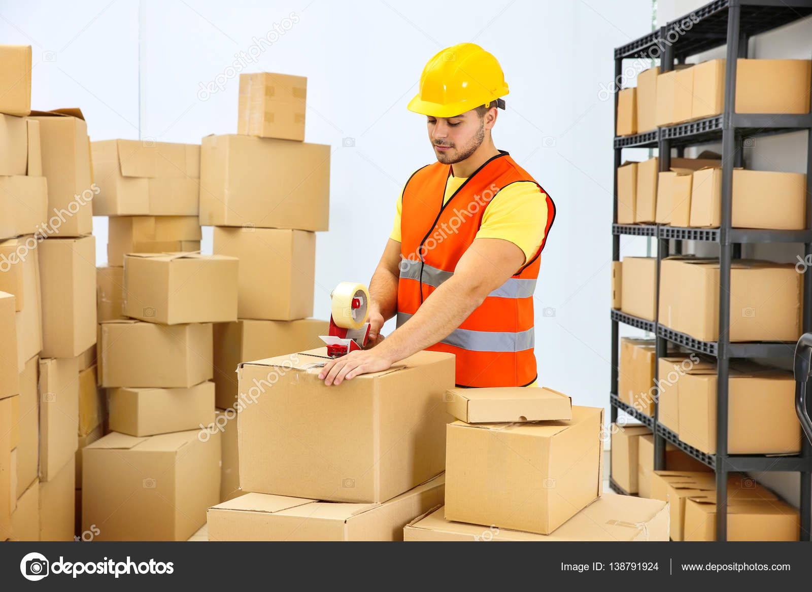 Man packing parcels — Stock Photo © belchonock #138791924