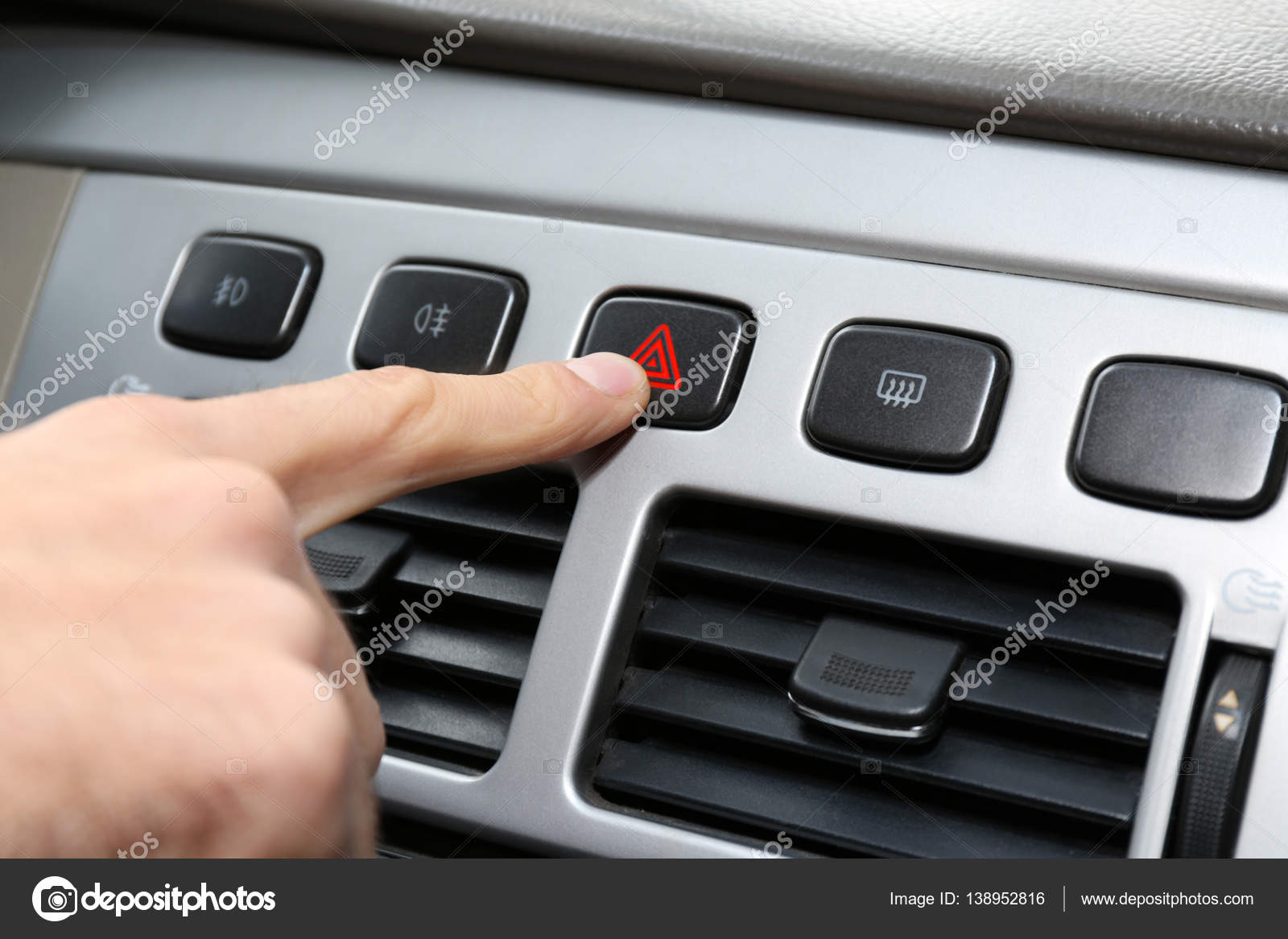 Hand pressing emergency warning button on car — Stock Photo ...