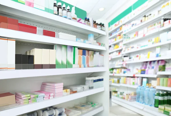 Various products on shelves at store — Stock Photo © belchonock #140115622