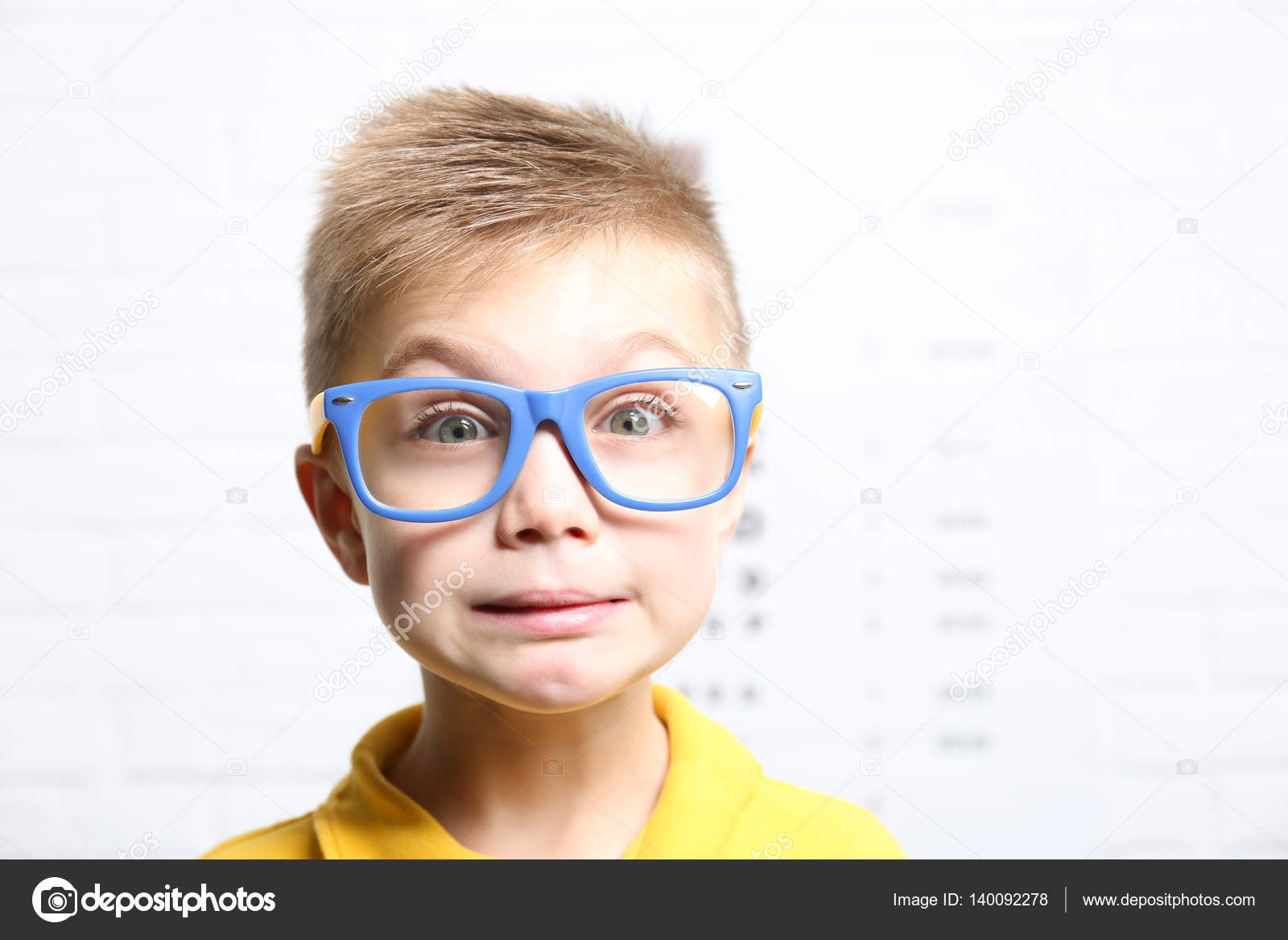 Boy with spectacles on ophthalmic test chart Stock Photo by ©belchonock ...