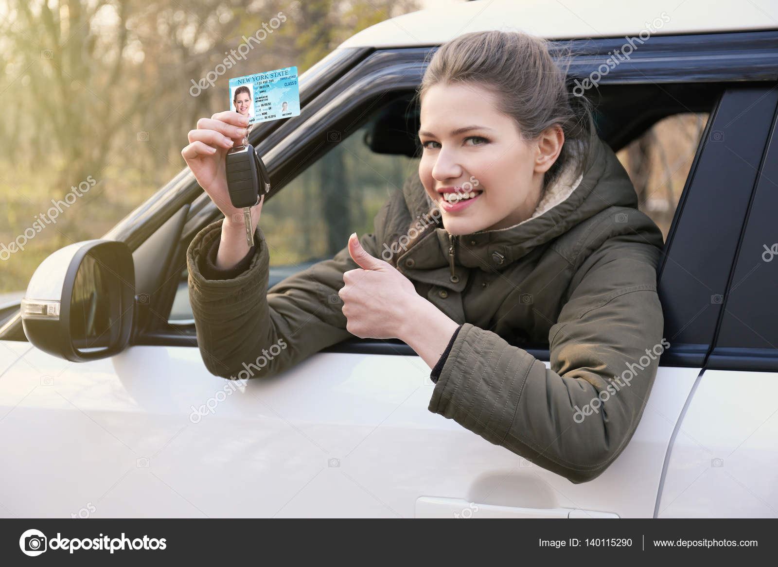 Woman with driving license Stock Photo by ©belchonock 140115290