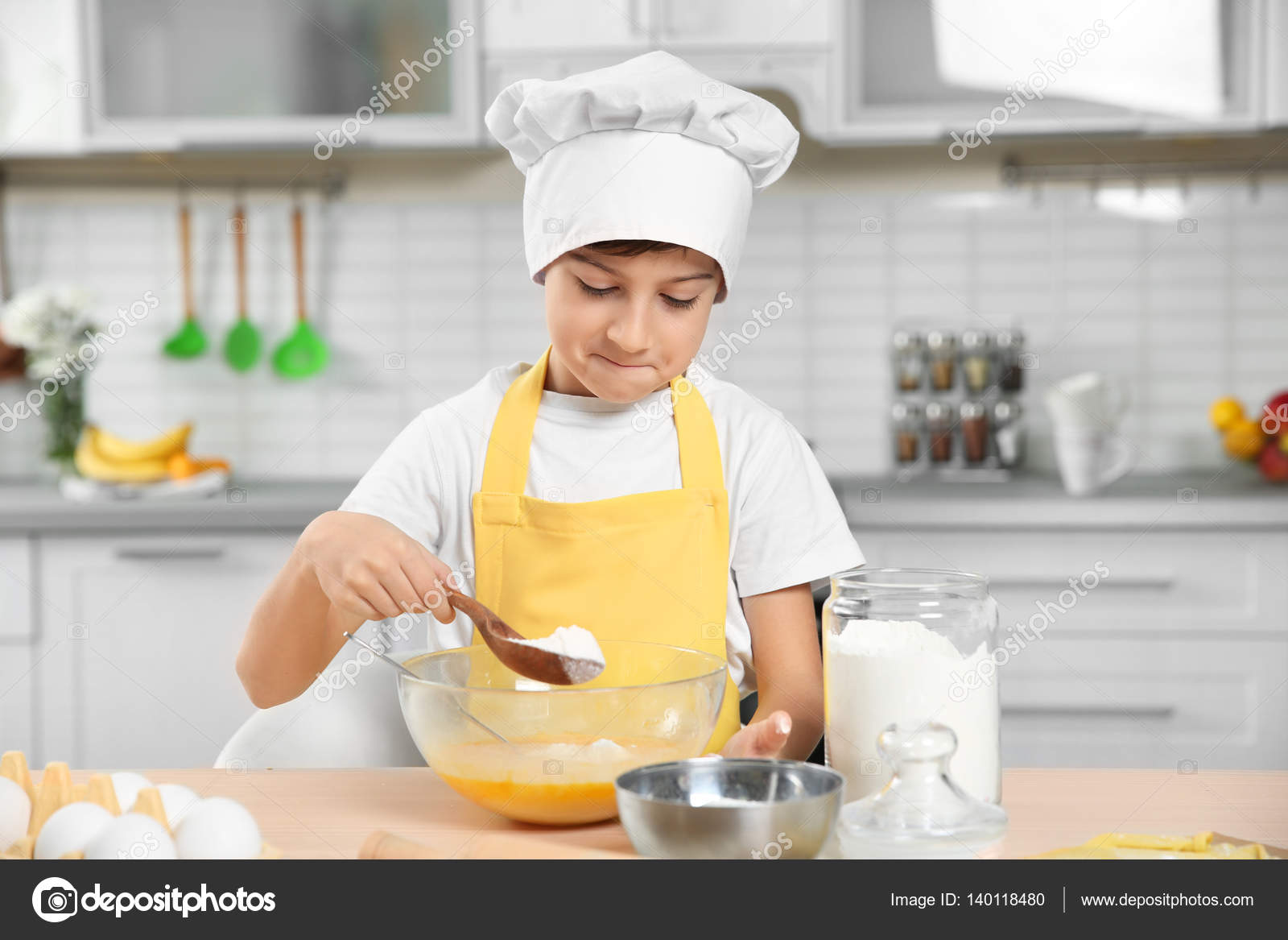 Cute boy cooking Stock Photo by ©belchonock 140118480