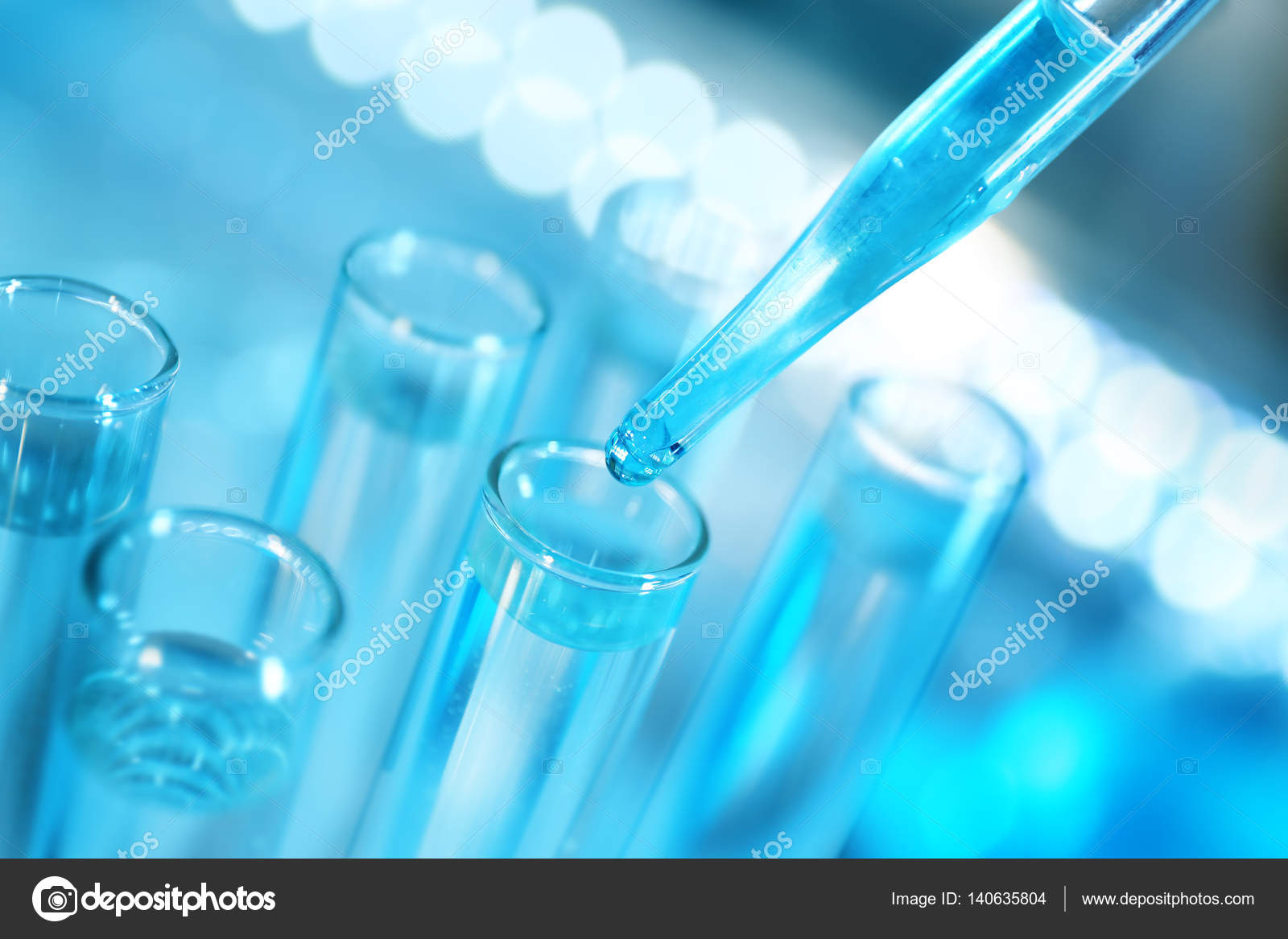 Pipette with laboratory flasks — Stock Photo © belchonock #140635804