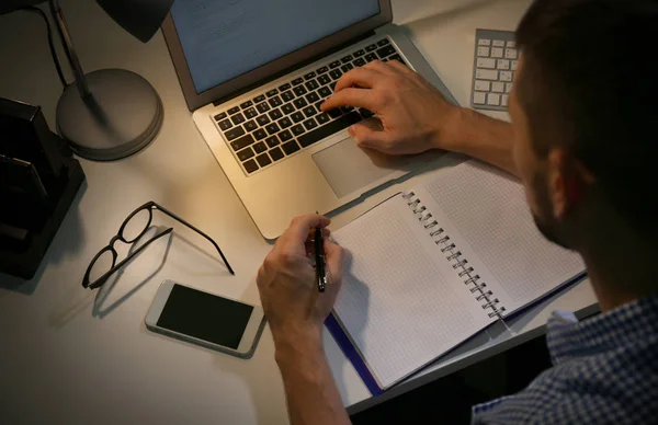 Young programmer working at home Stock Photo by ©belchonock 147123391