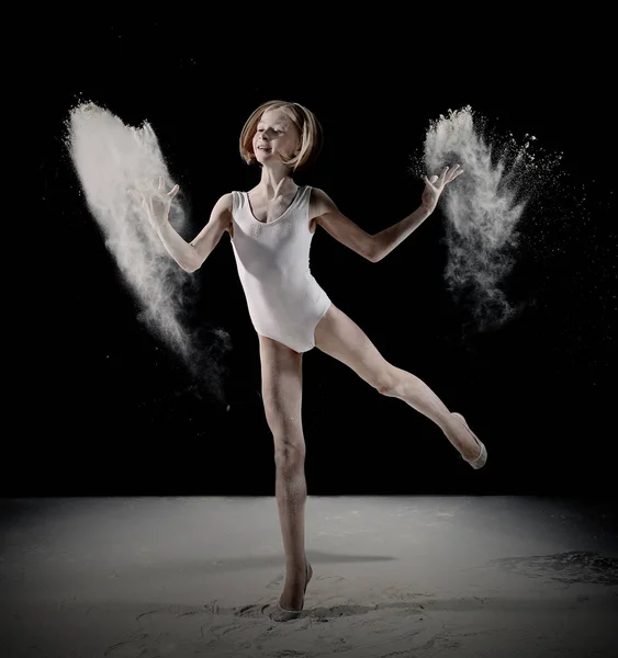 Little girl dancing with white powder Stock Photo by ©belchonock 140637110