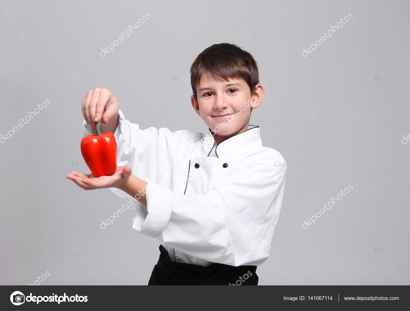 Cute boy in chef uniform Stock Photo by ©belchonock 141067114