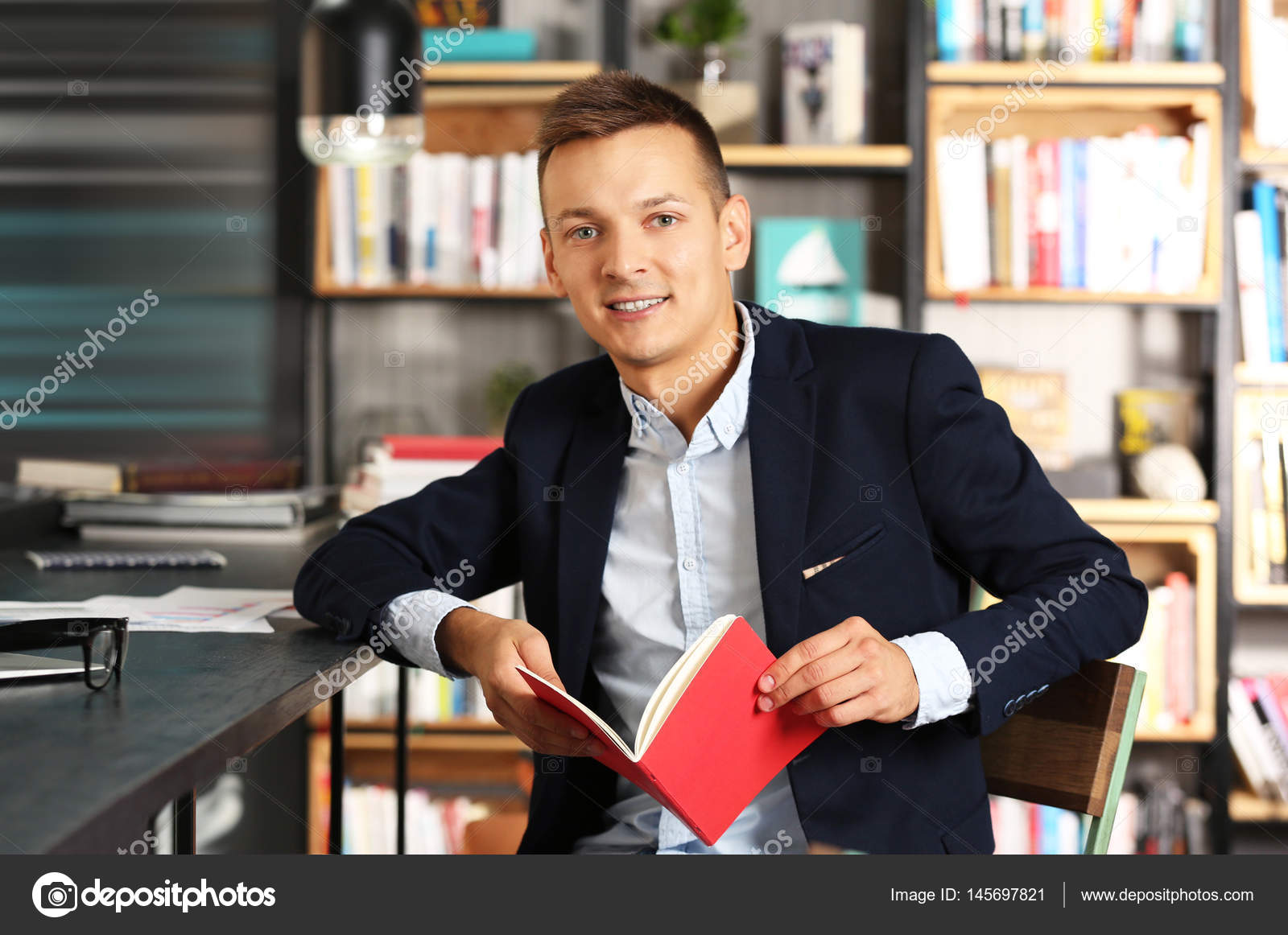 Handsome Man Studying Library Stock Photo by ©belchonock 145697821