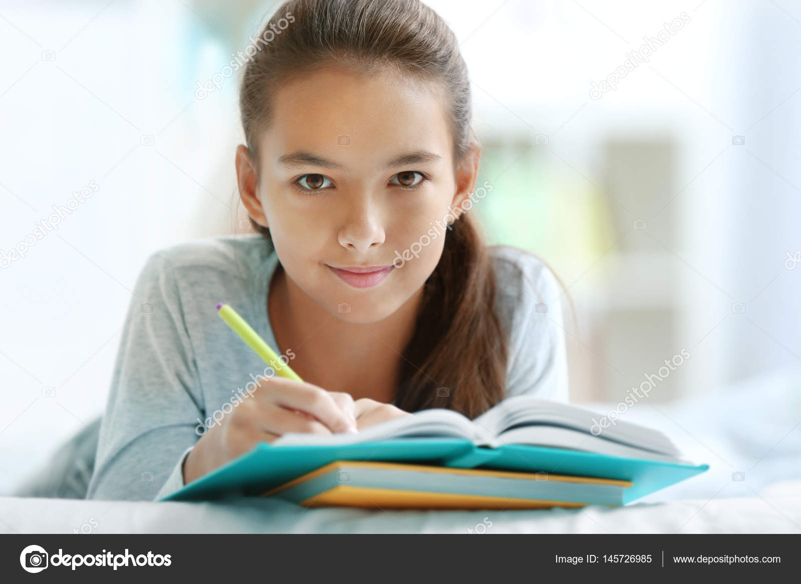 Cute girl doing lessons — Stock Photo © belchonock #145726985