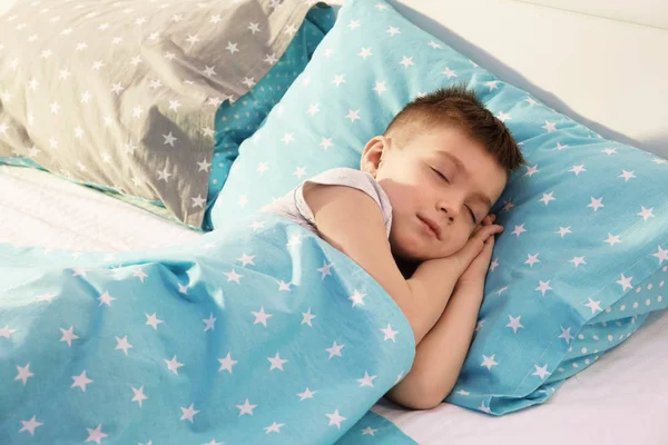 Little boy sleeping in bed Stock Photo by ©belchonock 147121809