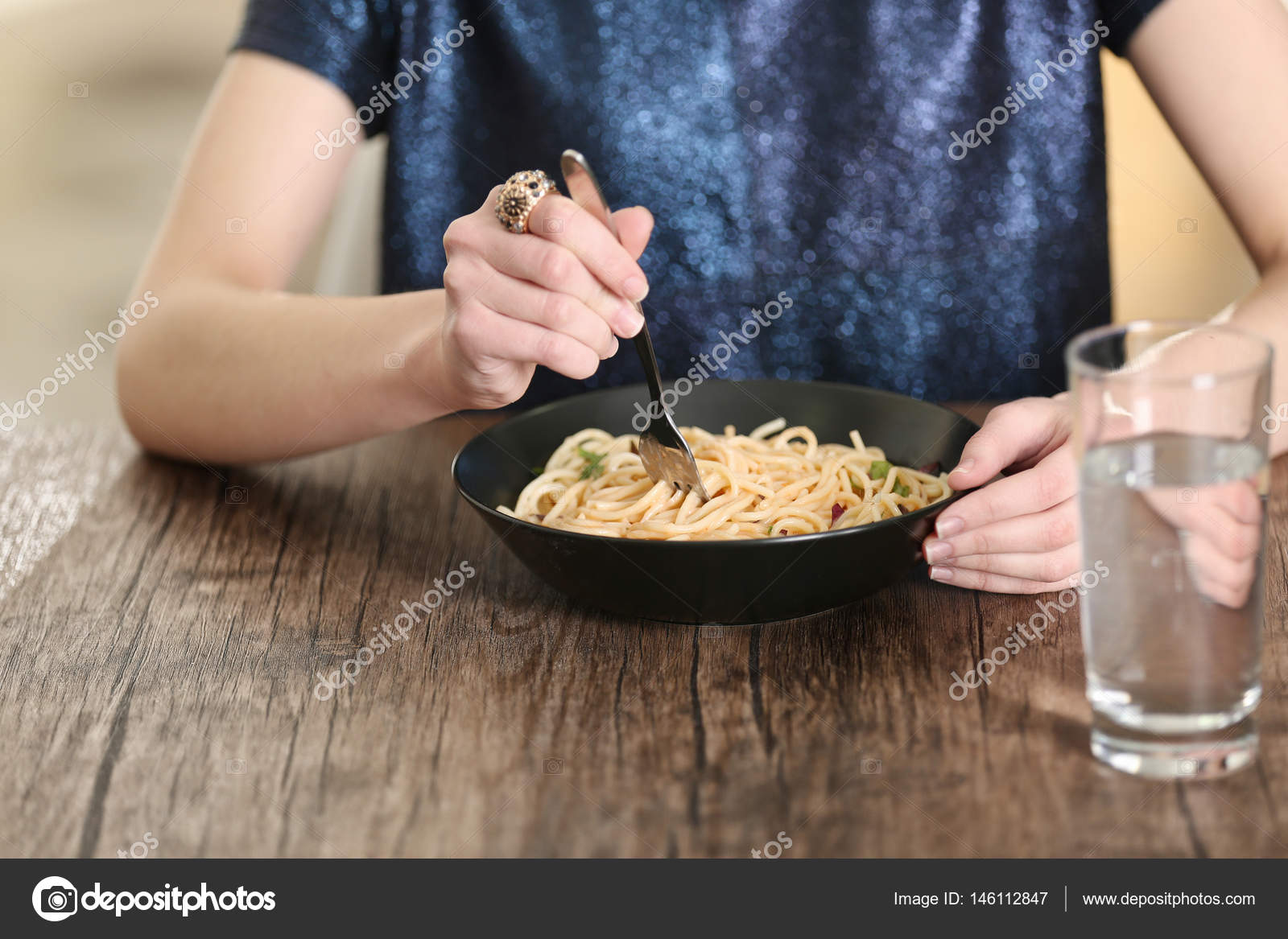 Woman eating pasta Stock Photo by ©belchonock 146112847