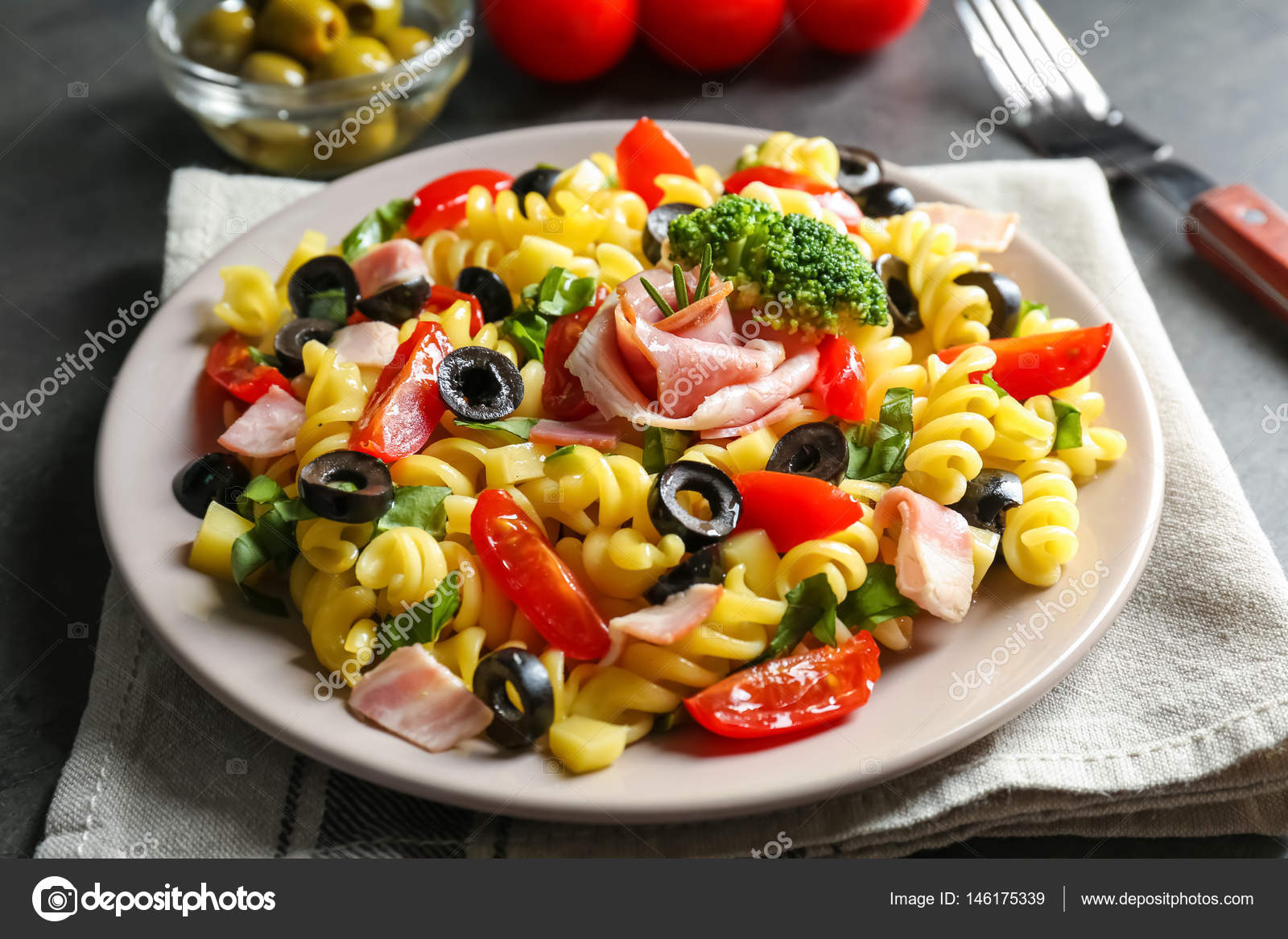 Cold pasta salad on table Stock Photo by ©belchonock 146175339