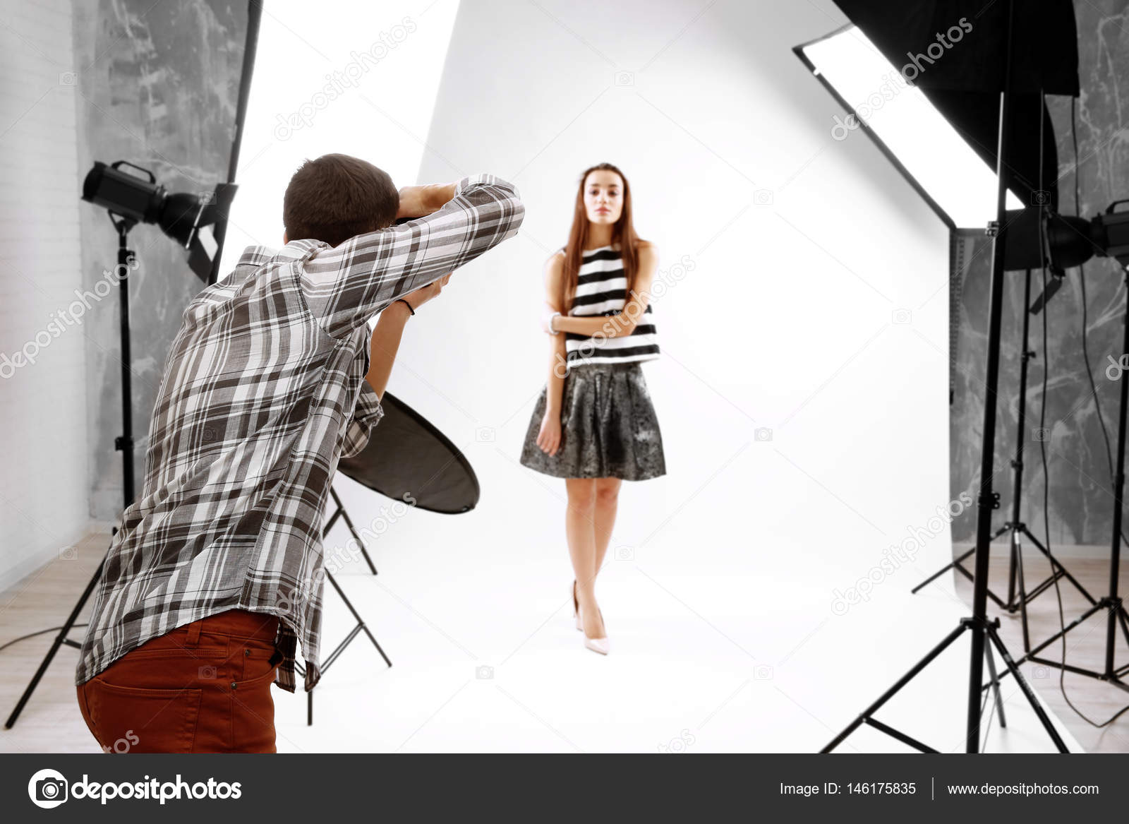 Photographer working with model Stock Photo by ©belchonock 146175835