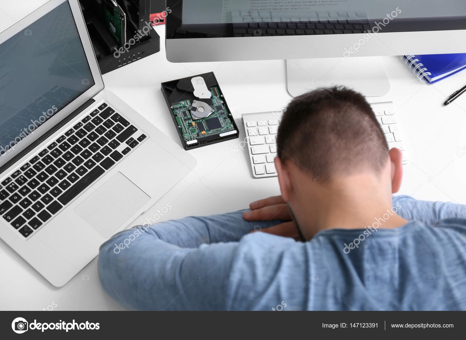 Young programmer working at home Stock Photo by ©belchonock 147123391