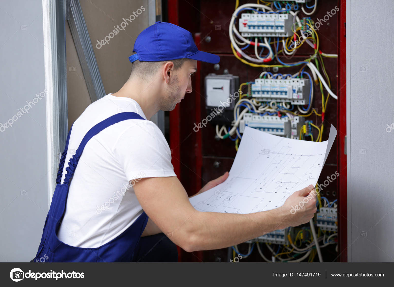 Electrician checking connections in distribution board — Stock Photo ...
