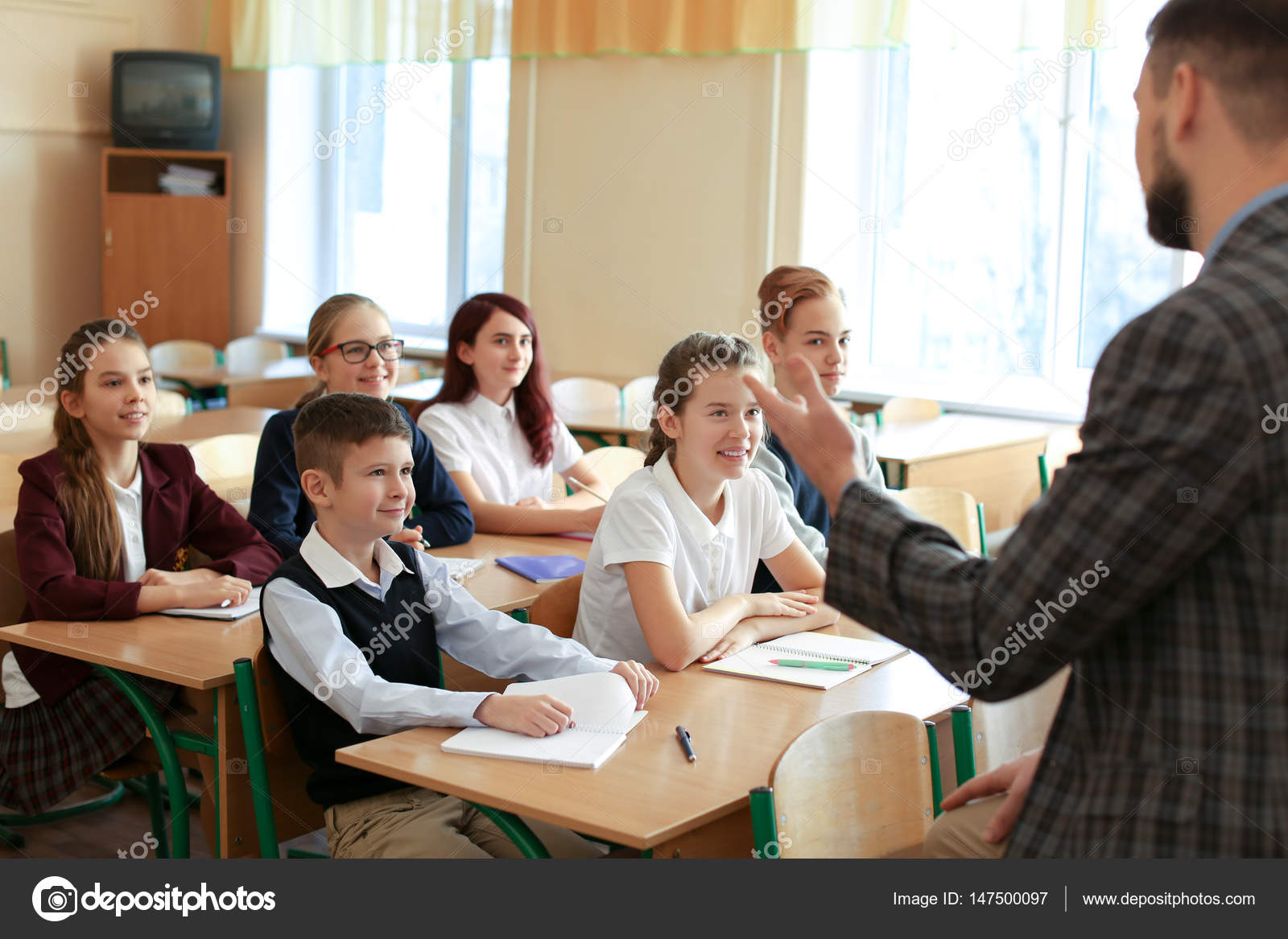 Pupils listening teacher in classroom Stock Photo by ©belchonock 147500097 Pupils listening teacher in classroom Stock Photo by ©belchonock 147500097