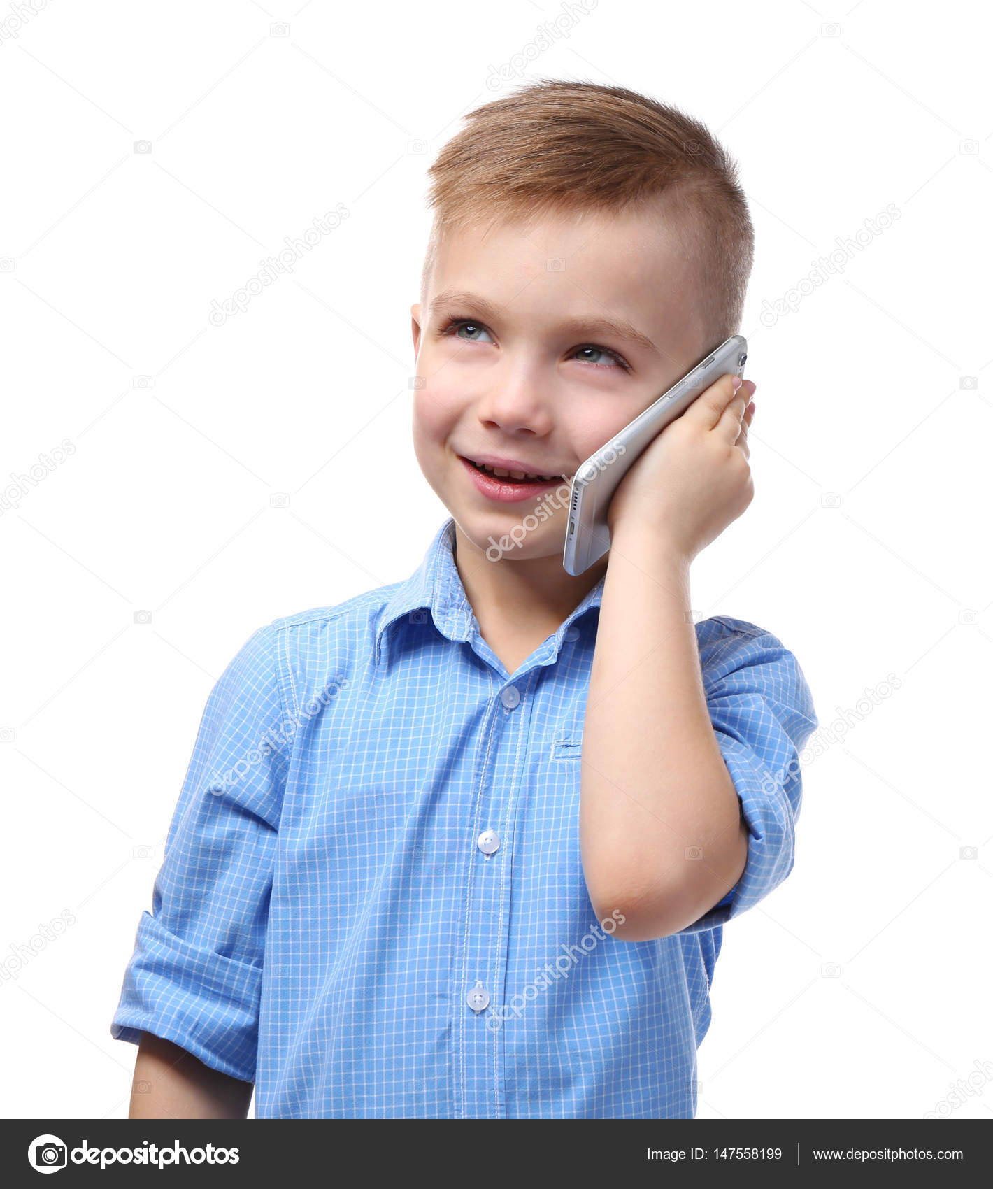 Cute little boy talking by phone Stock Photo by ©belchonock 147558199