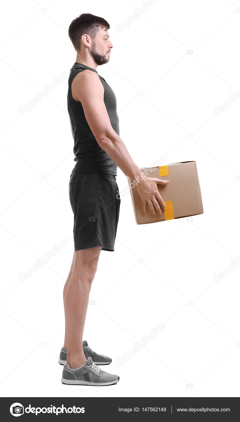 Man lifting heavy cardboard box — Stock Photo © belchonock #147562149