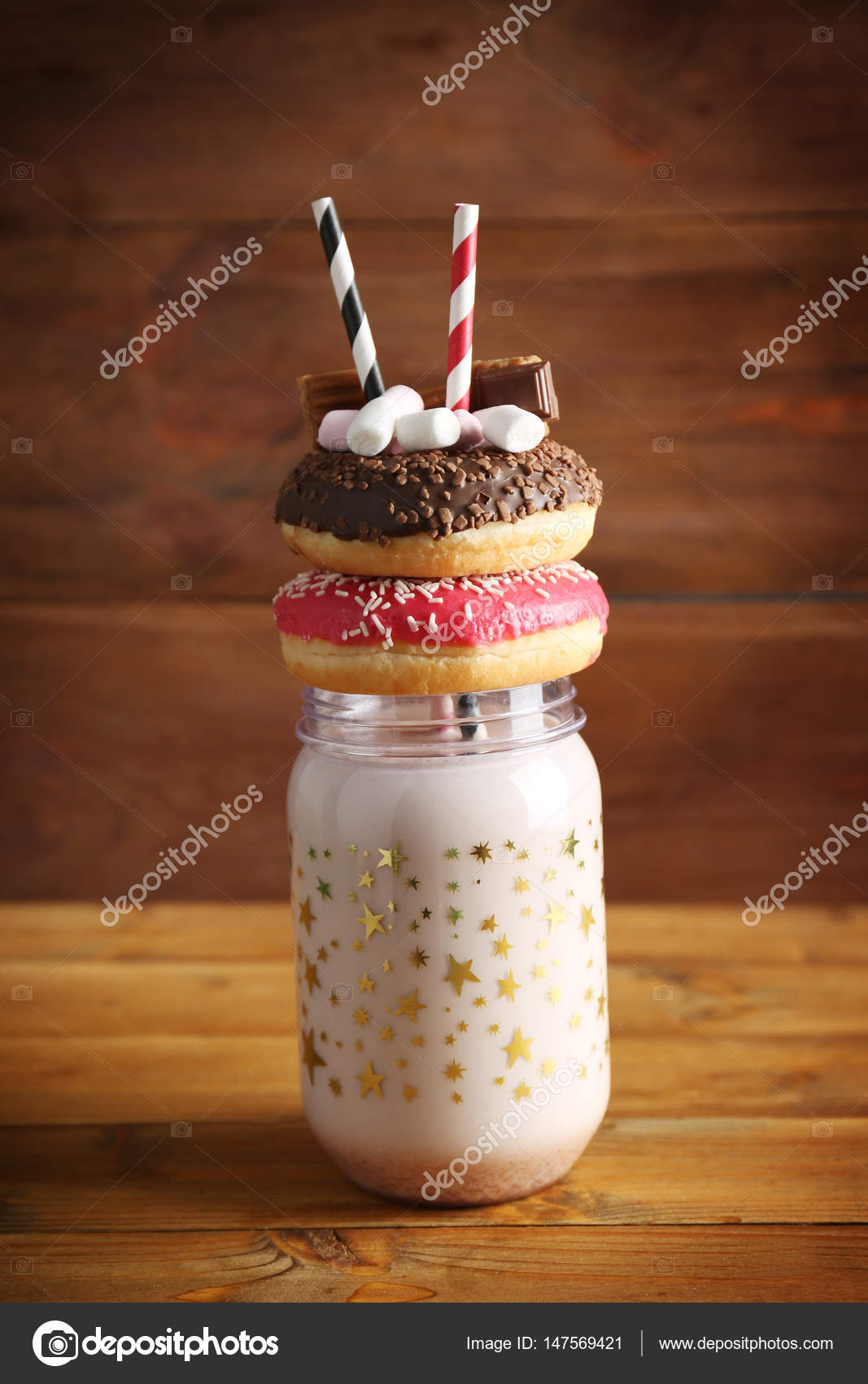 Donuts and sweets in jar Stock Photo by ©belchonock 147569421