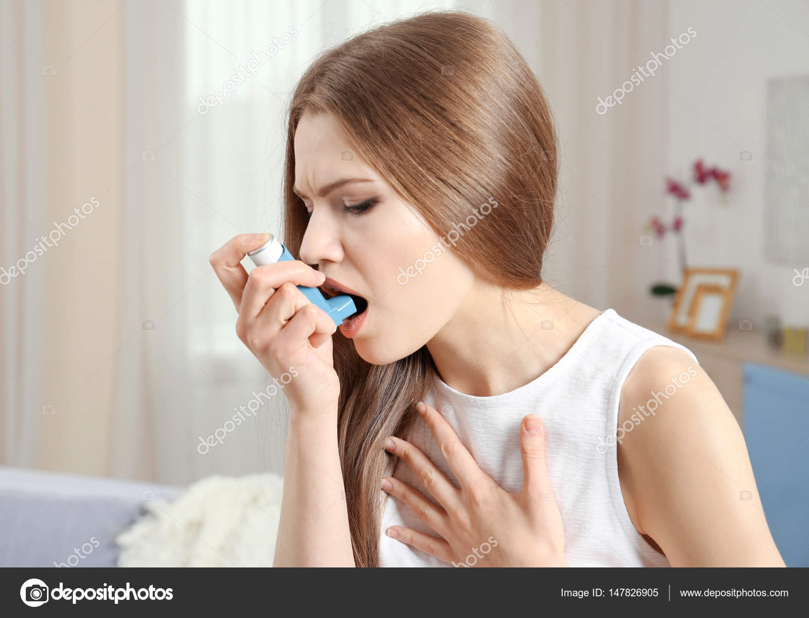 Woman using asthma inhaler — Stock Photo © belchonock #147826905