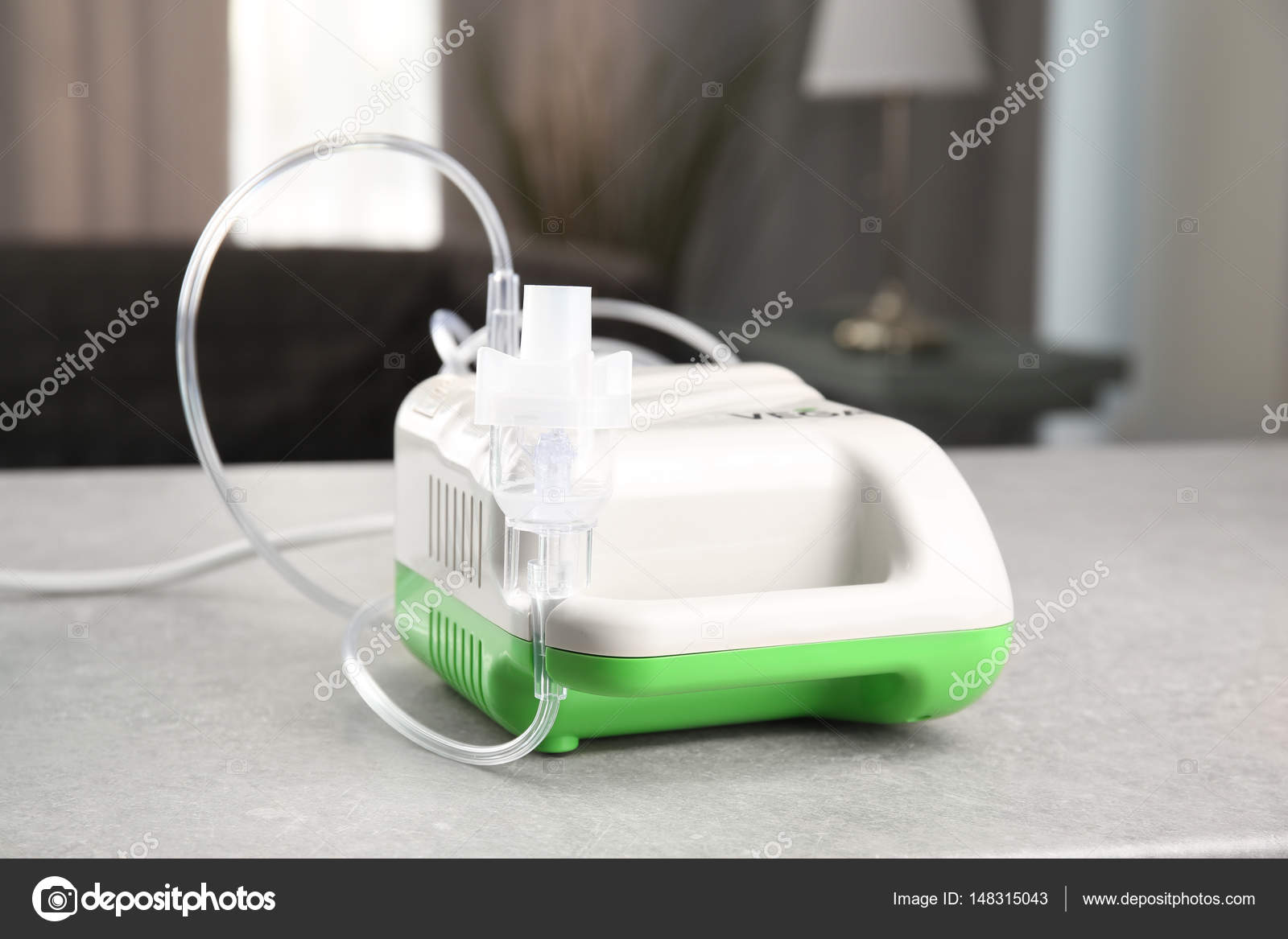 Compressor nebulizer on table Stock Photo by ©belchonock 148315043