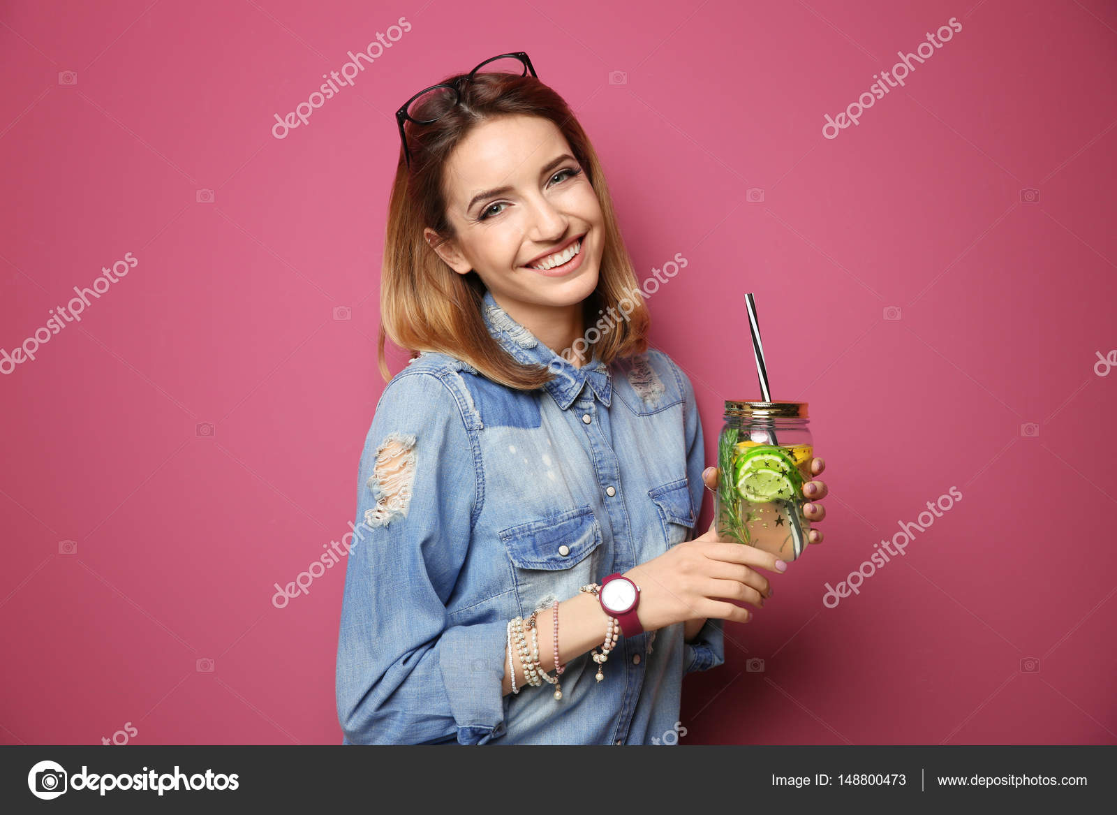 Beautiful young woman with lemonade Stock Photo by ©belchonock 148800473